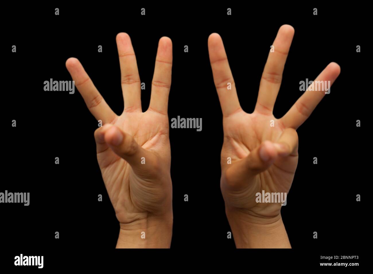 Pair of hands demonstrating Bhudi Yoga Mudra isolated over a black ...