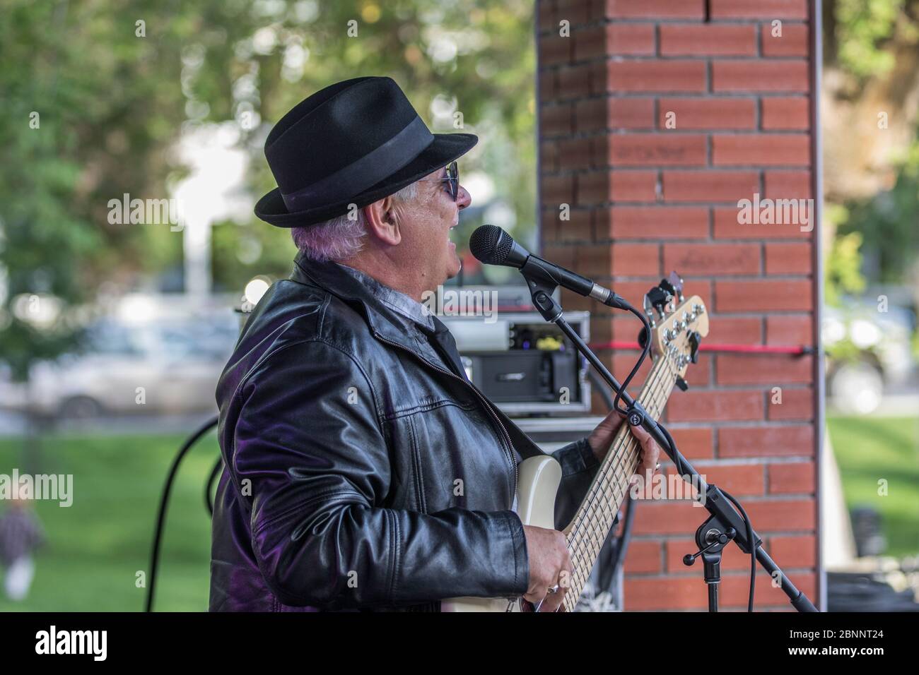 Bass guitar man playing bass guitar park hi-res stock photography and ...