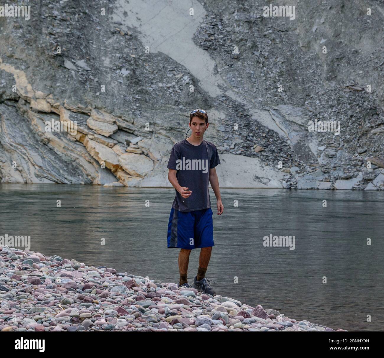 Young man skipping stones on hi-res stock photography and images - Alamy