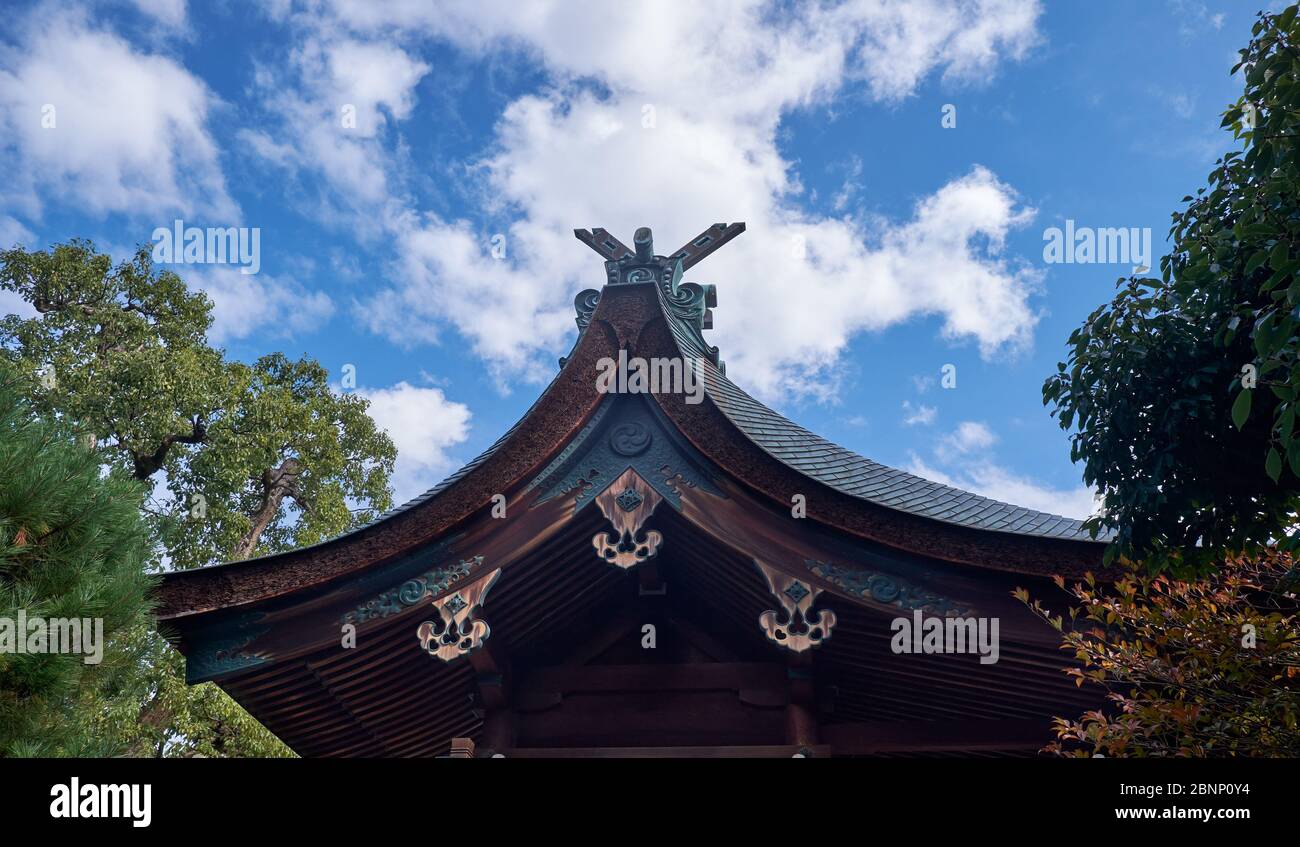 Cypress bark roof of Shikichi-jinja shrine main hall (honden) decorated ...
