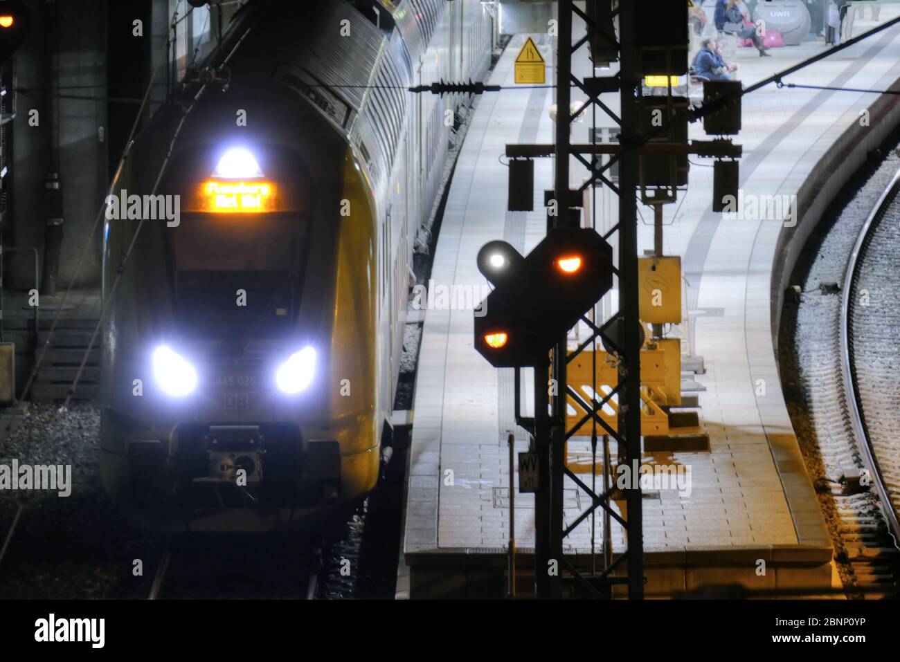 Local train with platform and train signal in Hamburg Central Station ...