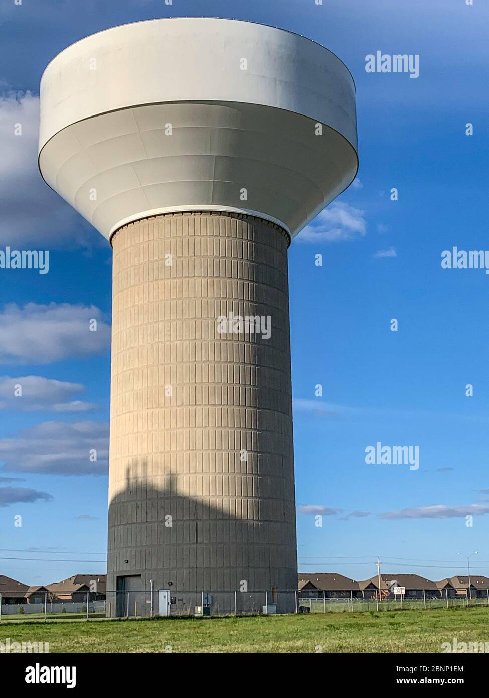 Concrete potable water supply tower in urban city setting Stock Photo ...