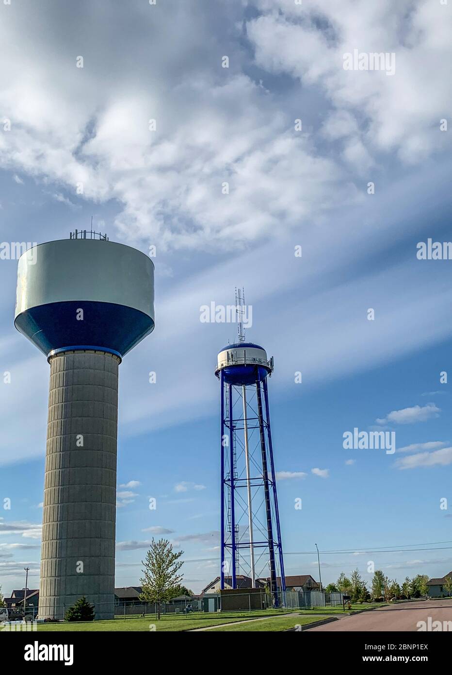 Two water tower structures located in an urban city Stock Photo - Alamy