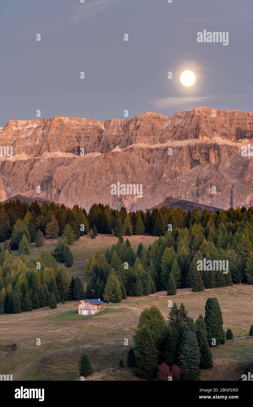 Europe the moon rising over the sella group hi-res stock photography ...