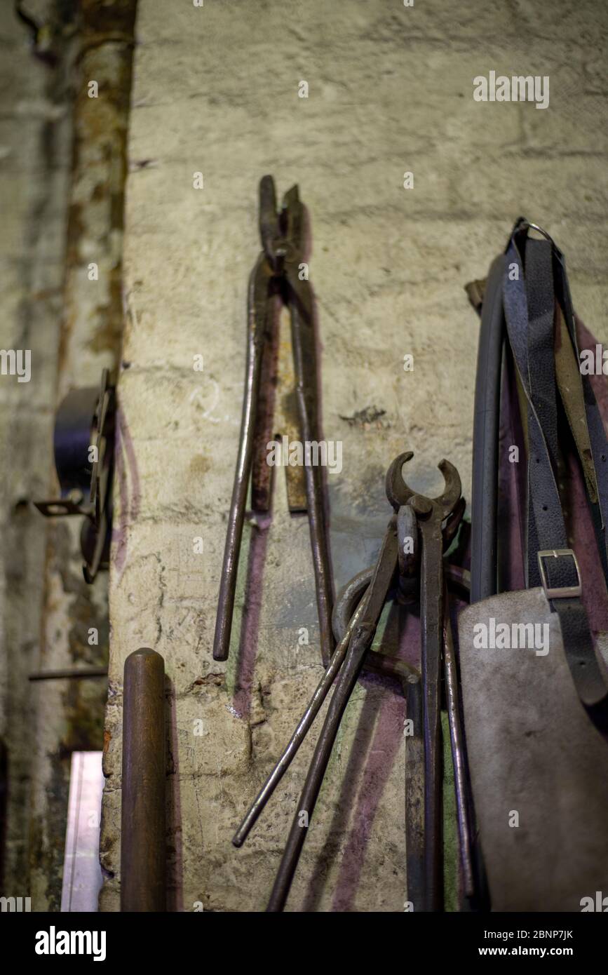 Tools in an old smithy Stock Photo - Alamy