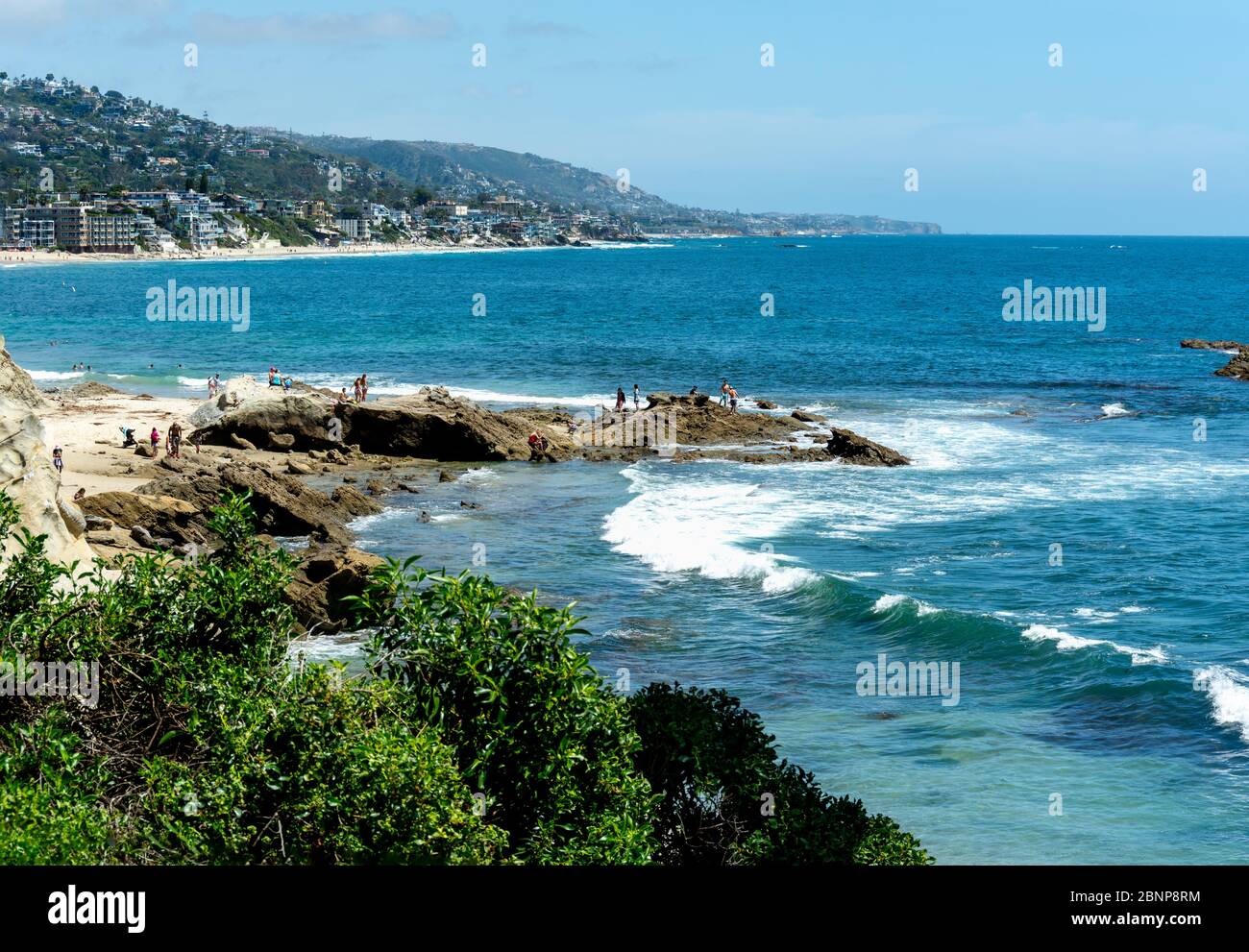 People frolic on the beach and rocks as Laguna Beach’s city beaches are ...