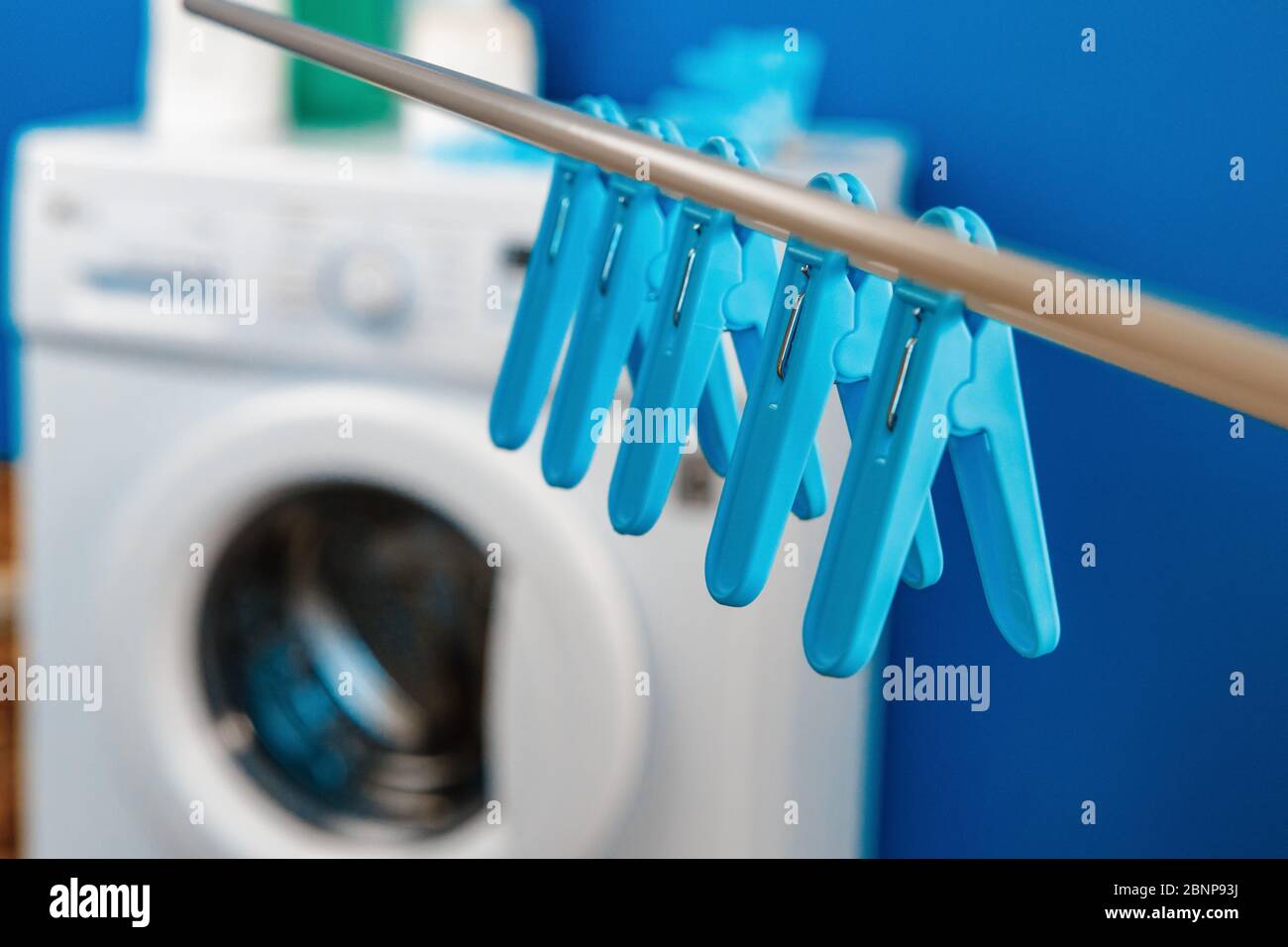 Laundry room interior with washing machine and clothes dryer near wall ...