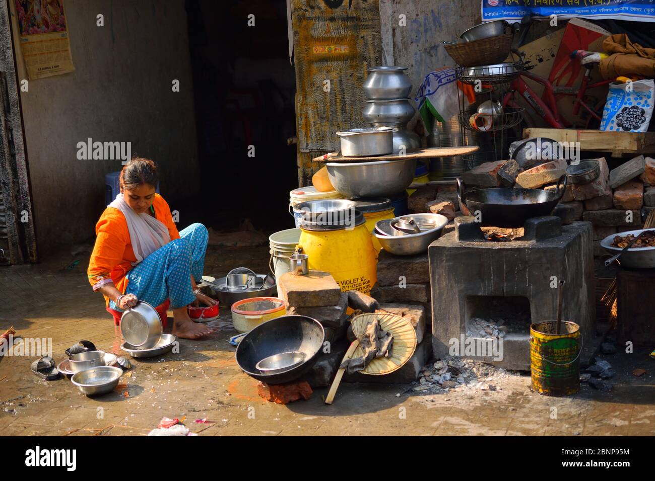 Woman washing utensils hi-res stock photography and images - Alamy