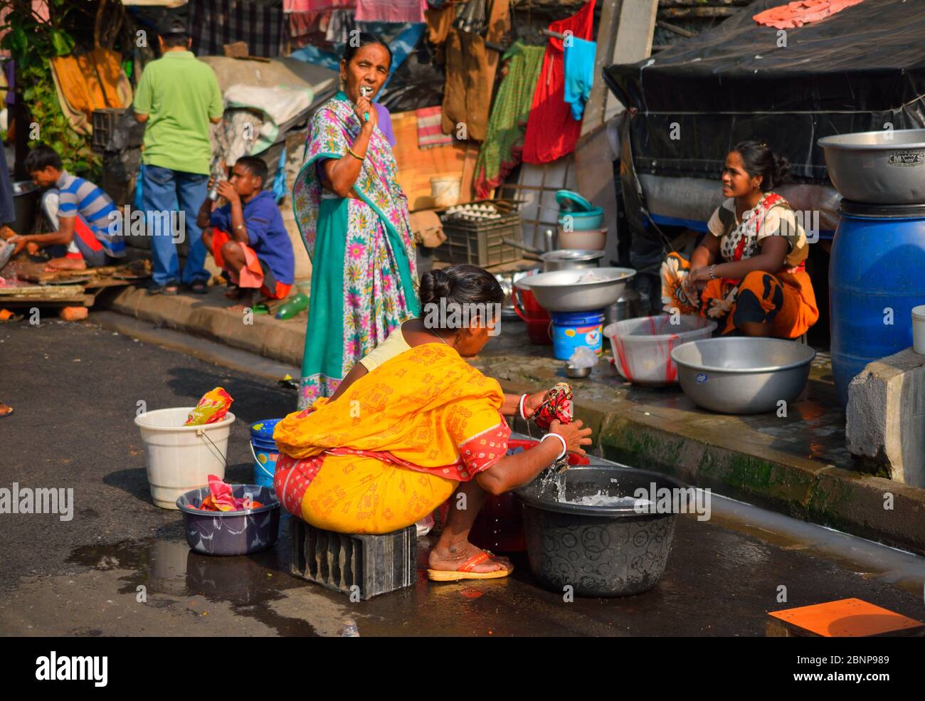 Women washing clothes hi-res stock photography and images - Alamy