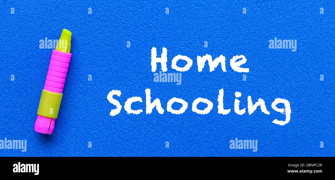 Homeschool. Words or typed text on blue board. wiht a yellow crayon ...