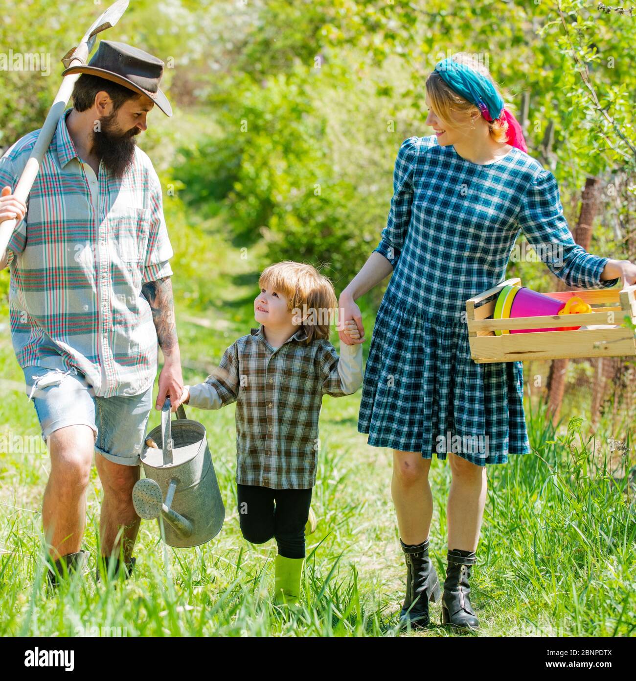 Family planting. Spring gardening routine. Earth day. Happy family ...
