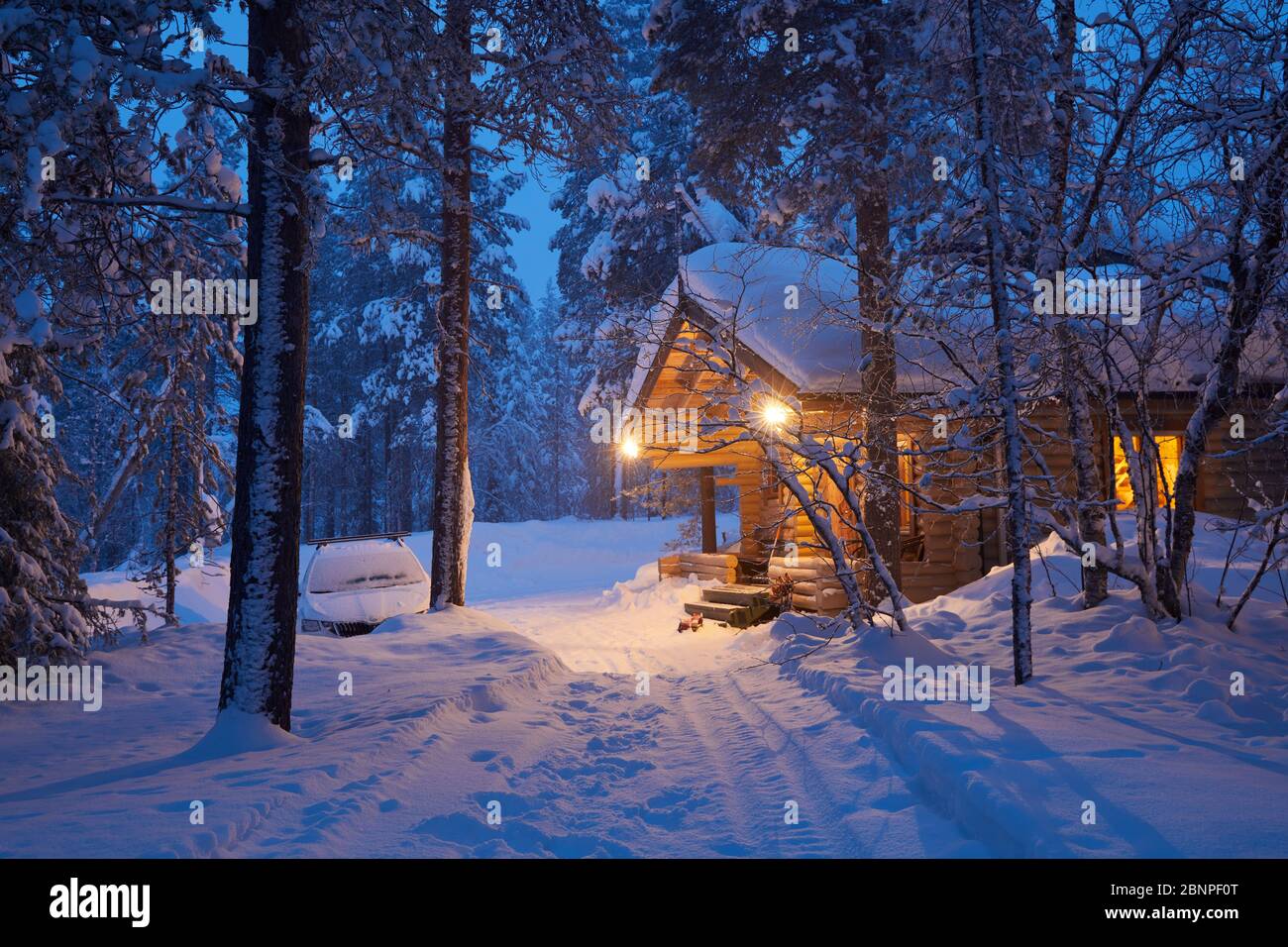 Finland, Lapland, log cabin, evening, winter Stock Photo - Alamy