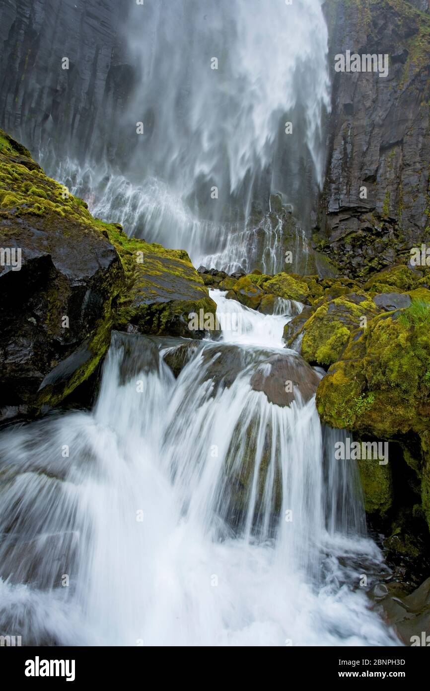 The Grundarfoss waterfall falls at Grundarfjoerdur 70m over a rock face ...