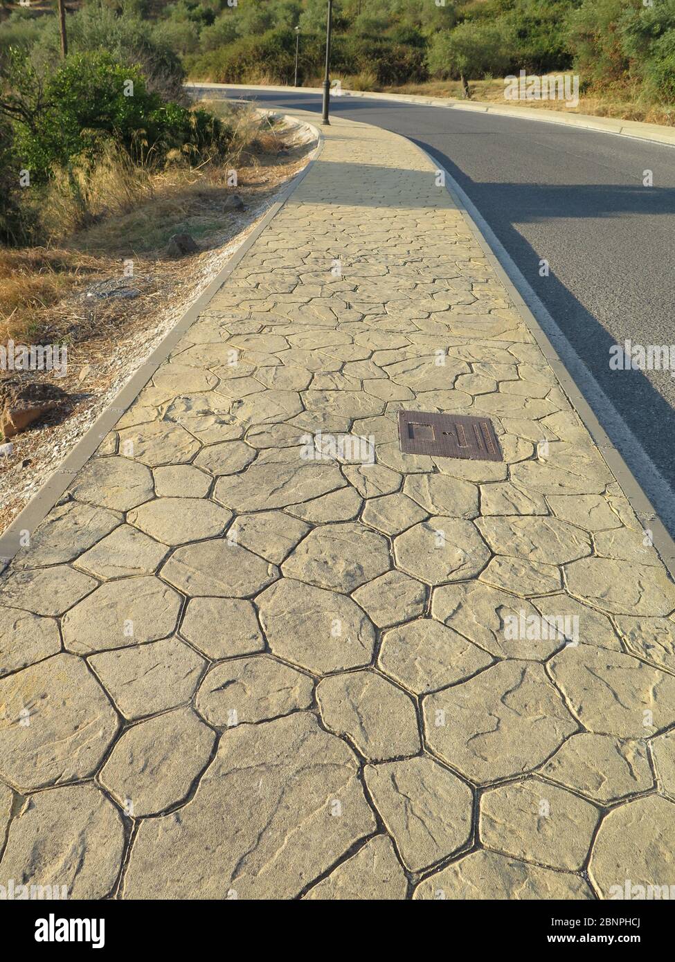 Patterned Pavement Slabs in urban road in Andalusian village Stock ...