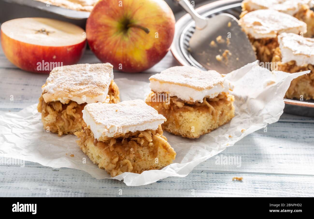Three cubes of apple pie with a whisked wgg whites topping on a napkin ...