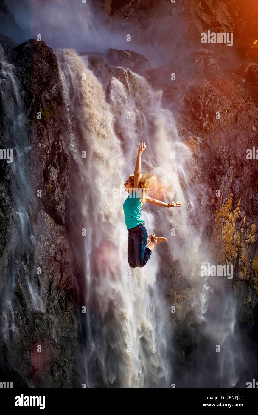 Woman jumping waterfall hi-res stock photography and images - Alamy