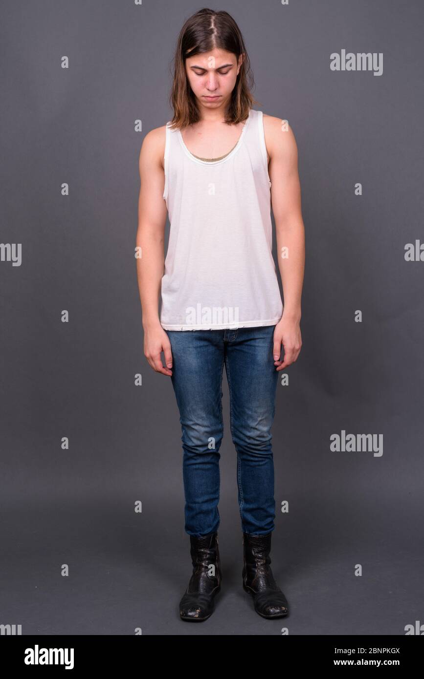 Young handsome androgynous man with long hair Stock Photo - Alamy