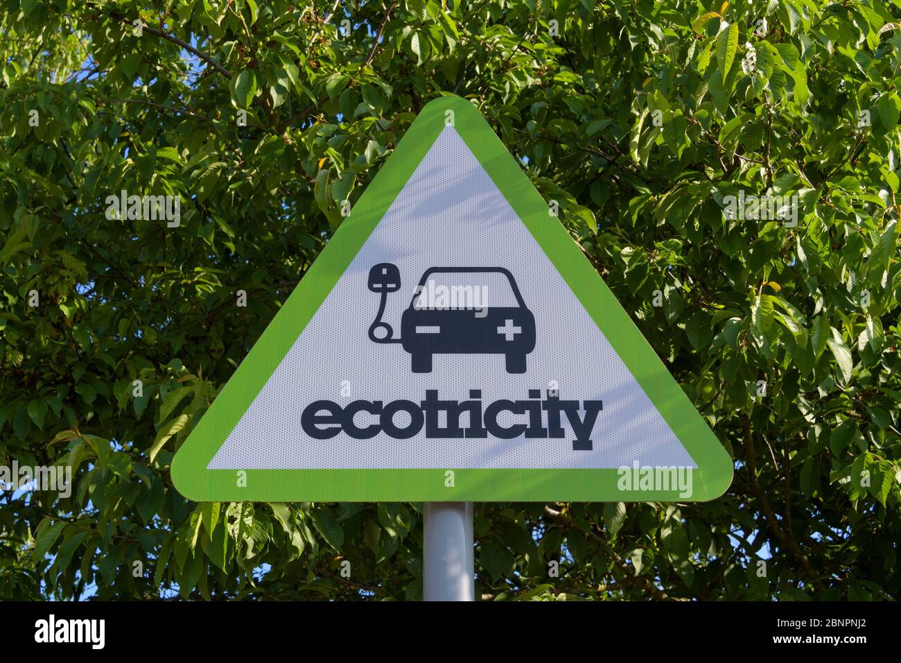 Electric vehicle recharging point sign at motorway rest area, South ...