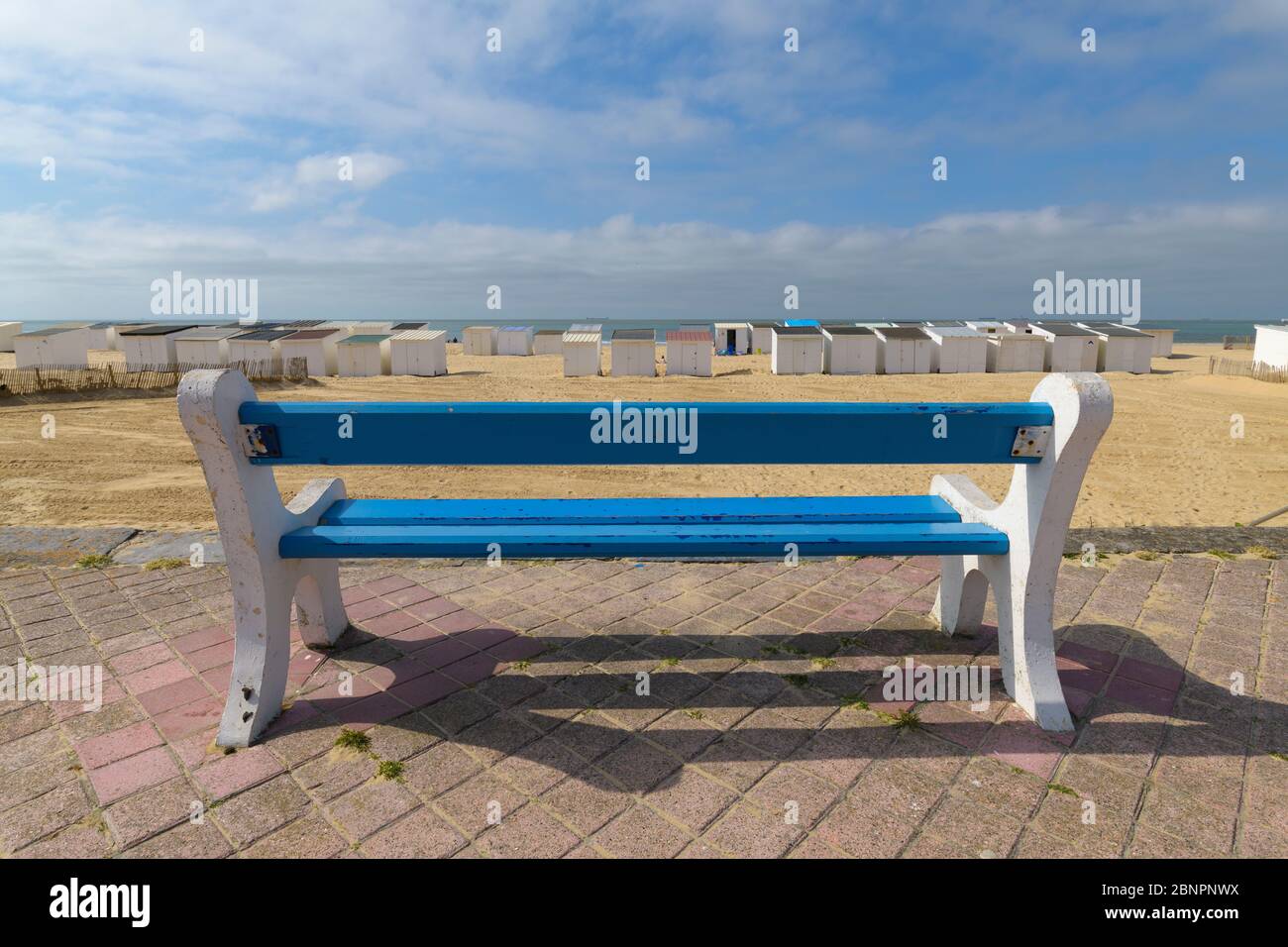 Bench on the beach with beach houses hi-res stock photography and ...