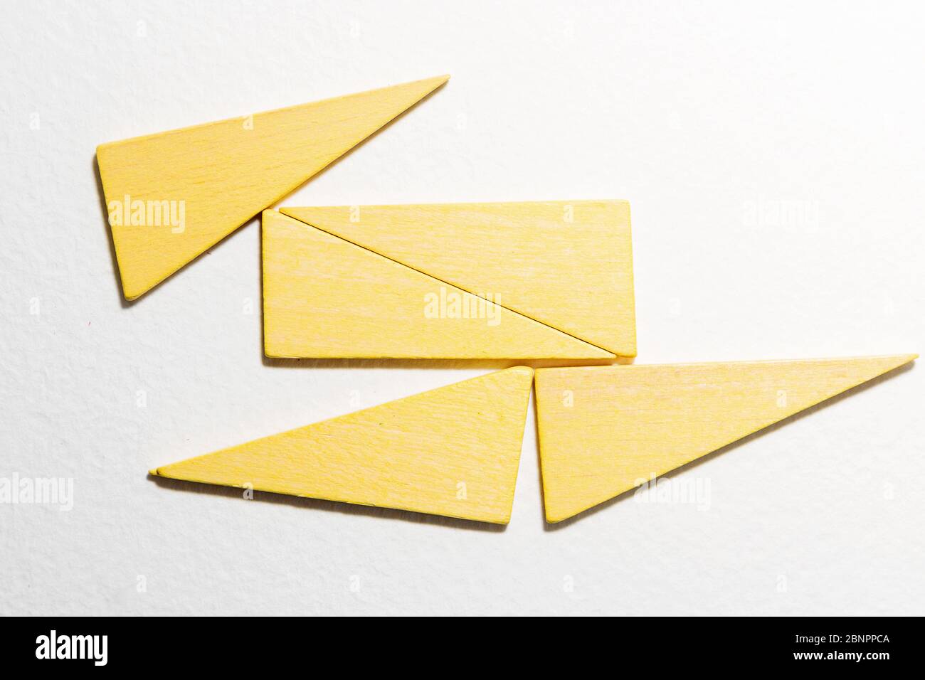 Different colorful triangles wooden on white background. Geometric ...