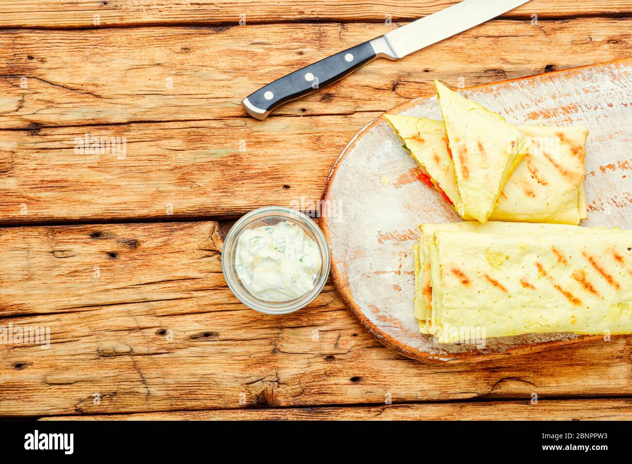 Traditional eastern shawarma with chicken,cheese and mushrooms on ...