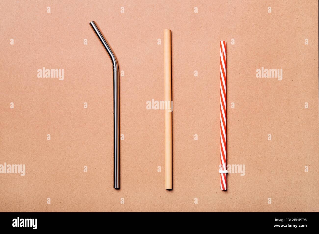 Different kinds of straws. Reusable bamboo, stainless steel and single ...