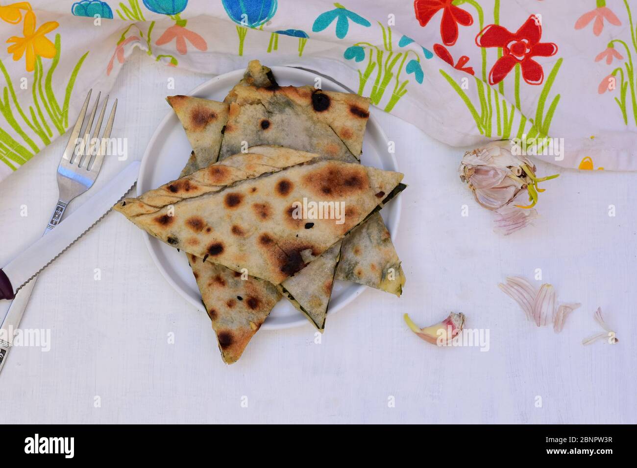 Slices of baked pied stuffed whit beet leafs and garlic/ Traditional ...