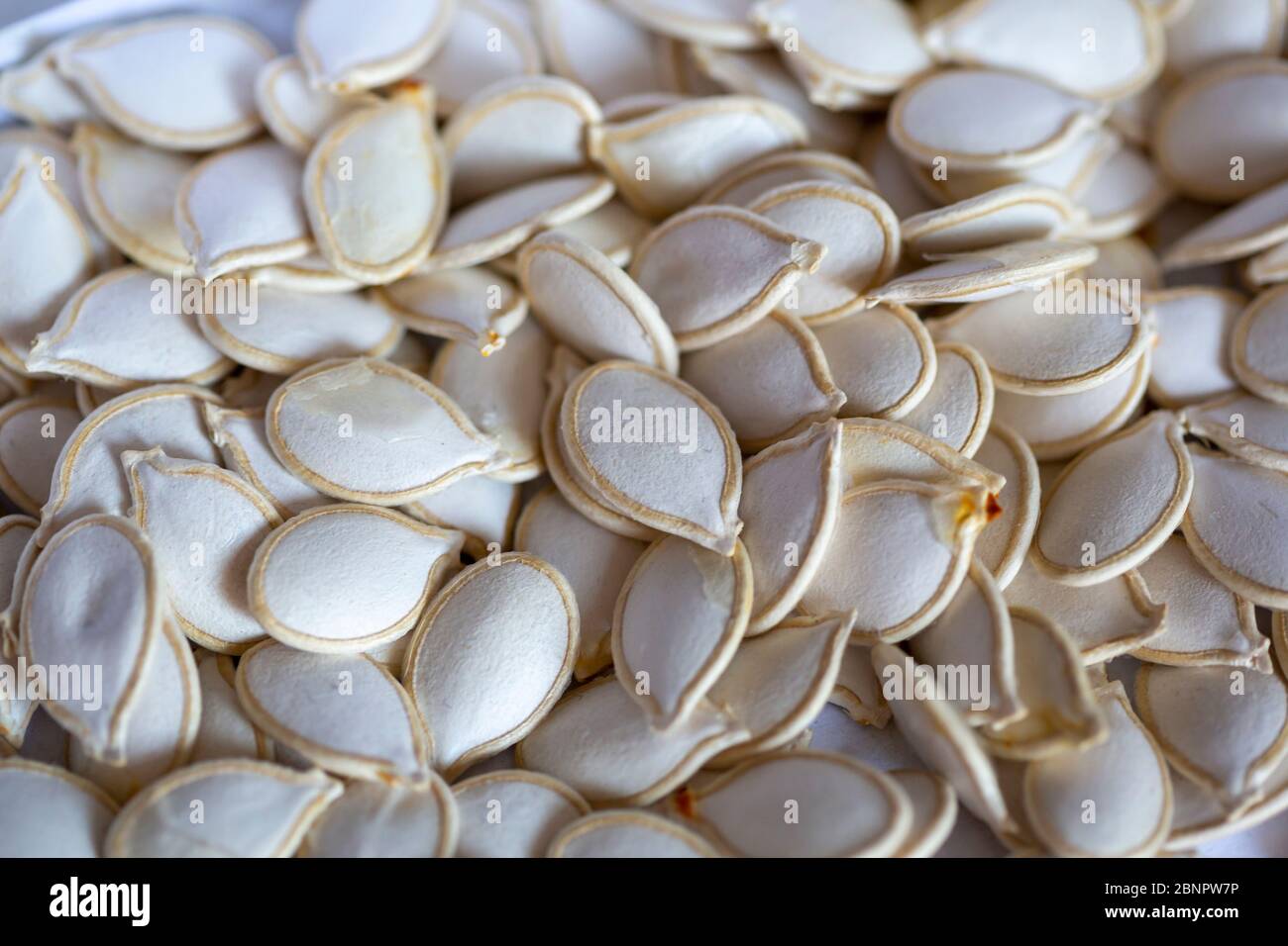 close up pumpkin seeds background Stock Photo - Alamy