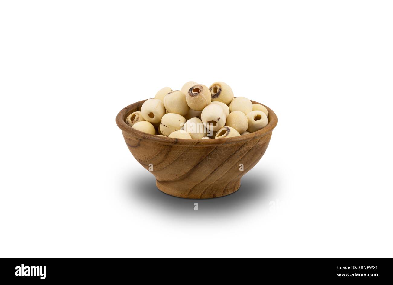 Dried Lotus Seeds in wooden bowl on white background with clipping path ... Dried Lotus Seeds in wooden bowl on white background with clipping path ...