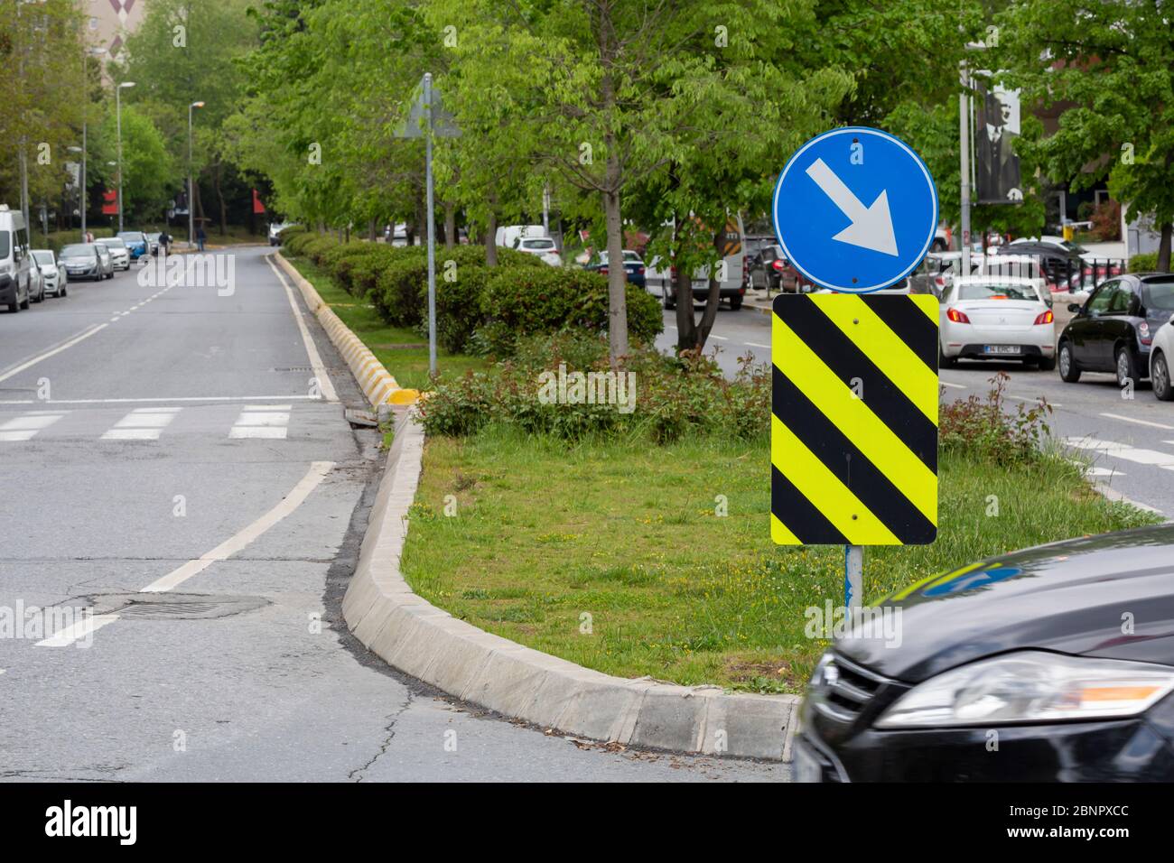 Road sign indicating right turn Stock Photo - Alamy
