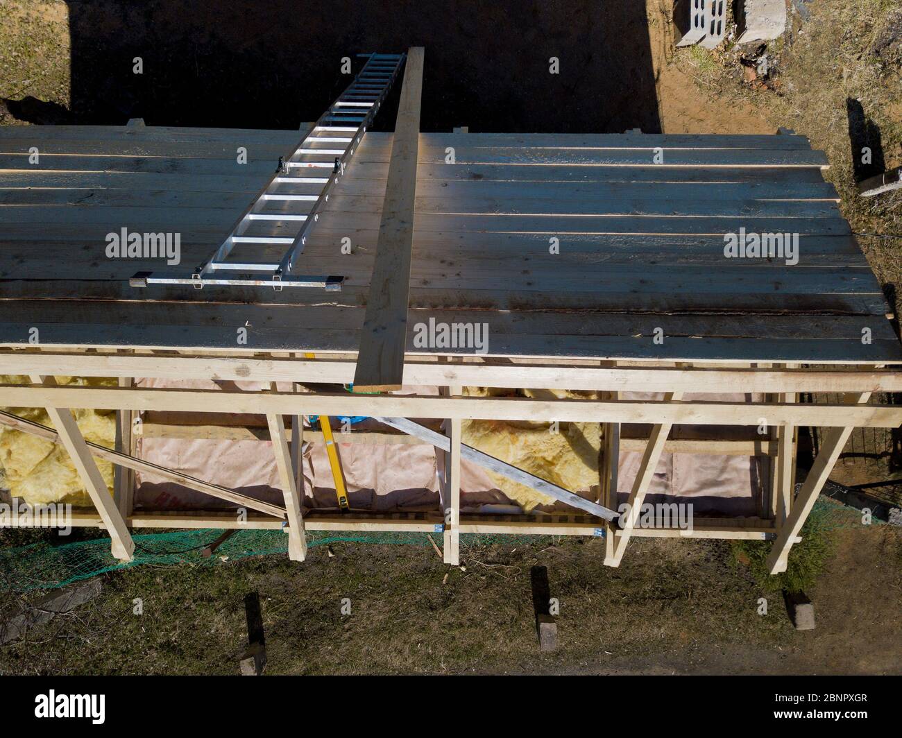 Insulation of a new wooden house, overhead outdoor shot Stock Photo - Alamy
