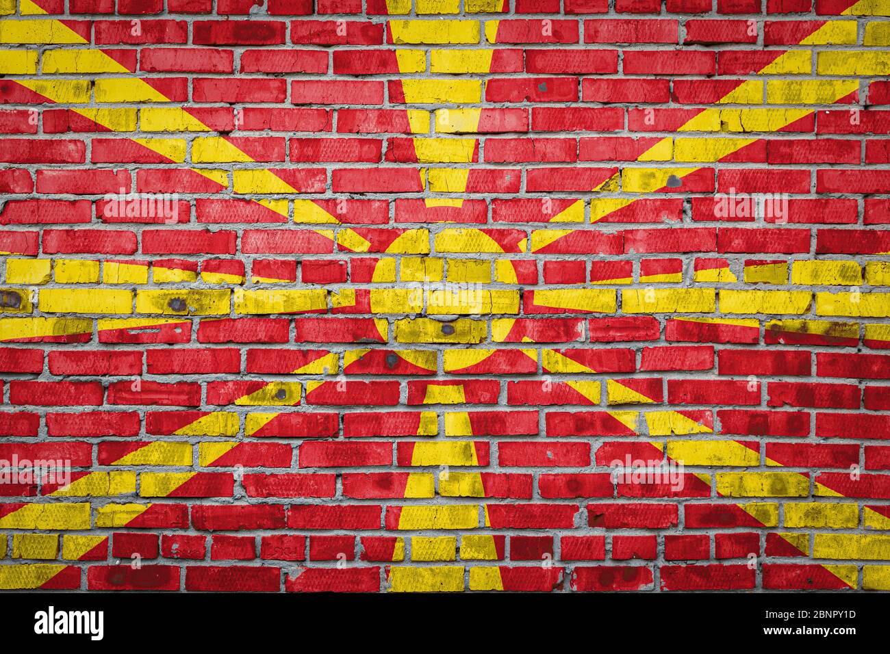 National flag of Macedonia depicting in paint colors on an old brick ...