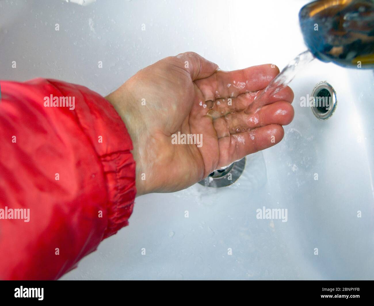 Close-up shot of a hand under waer running of the tap Stock Photo - Alamy
