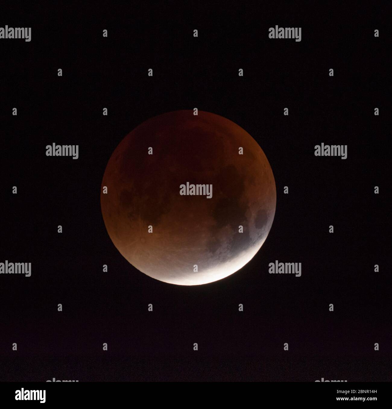 London, UK. 28th October 2015. Total lunar eclipse forming with a blood ...