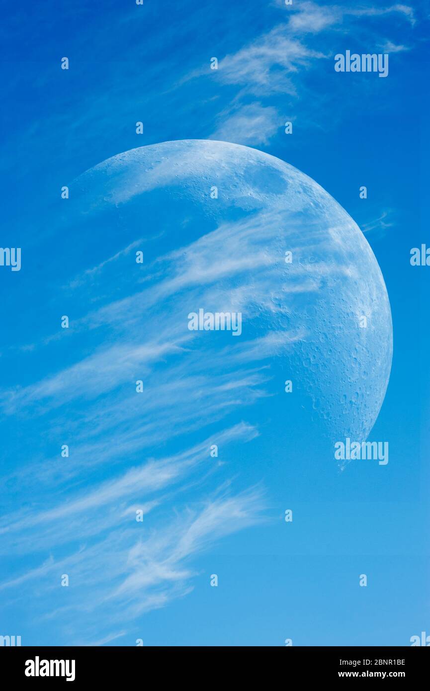Cirrus clouds and daytime moon in blue sky, London, UK Stock Photo - Alamy