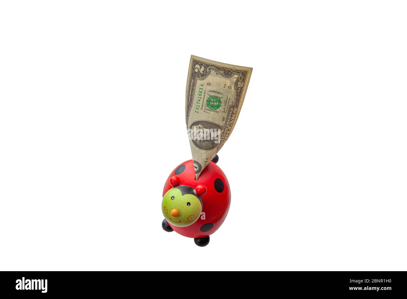 Cute red, black and green lady bug like piggy bank with a two dollar ...