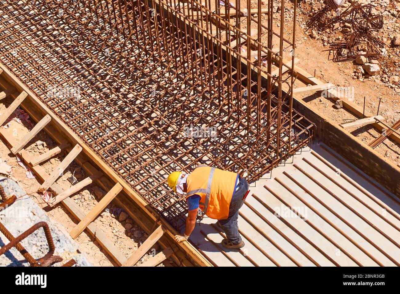 Worker on reinforcement work at construction site Stock Photo - Alamy