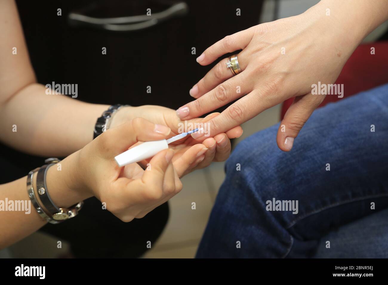 Girl painting her fingernails hi-res stock photography and images - Alamy
