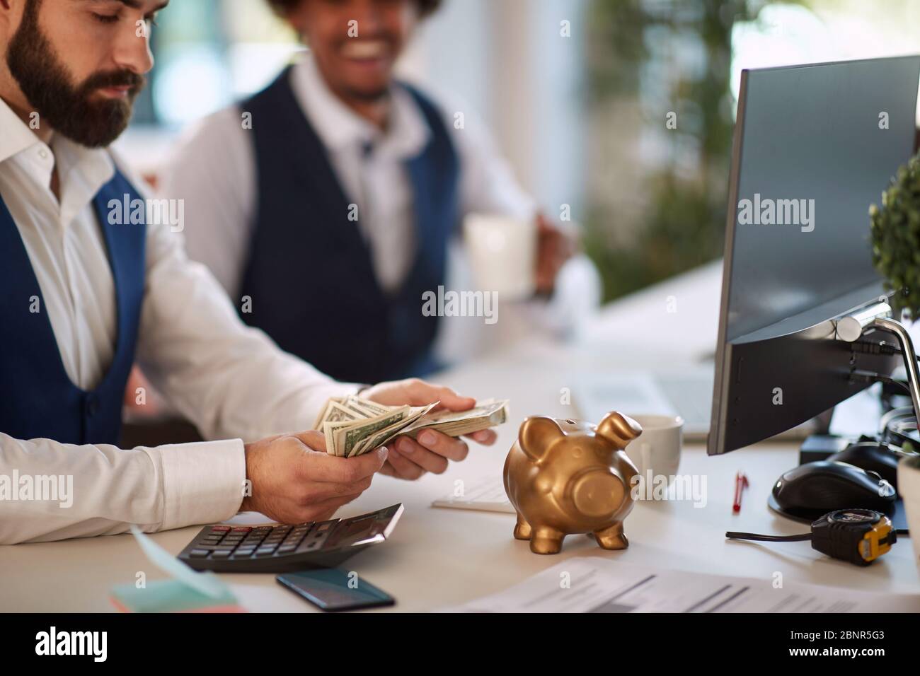 Closeup of a businessman counting earned money. Business partner ...