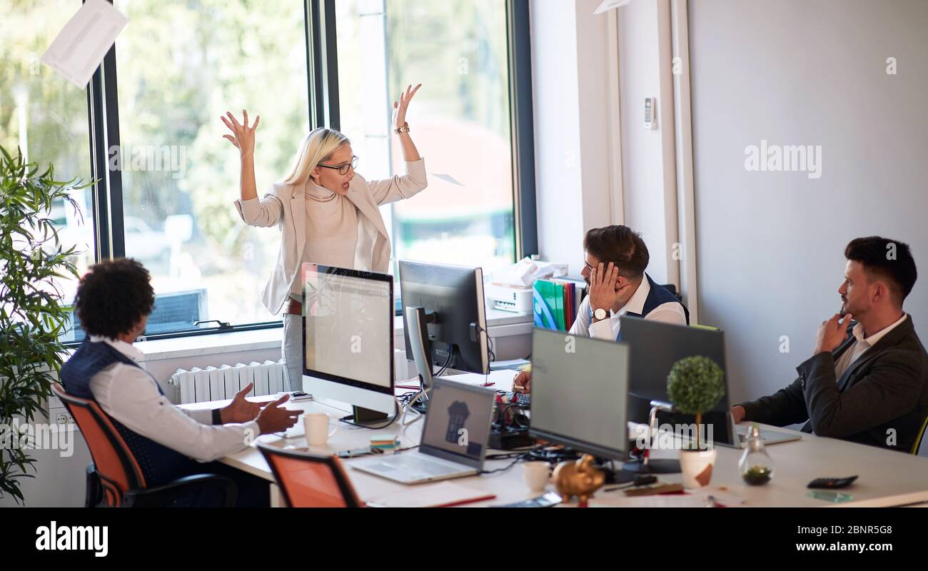 Angry boss throwing papers and yelling at the office. Boss getting mad ...
