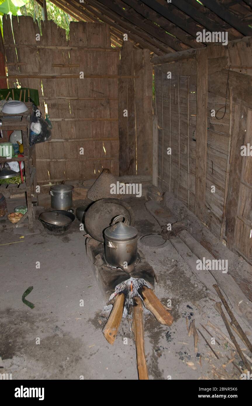 Traditional wood-fired stove in rural kitchen in wooden house, Randu ...
