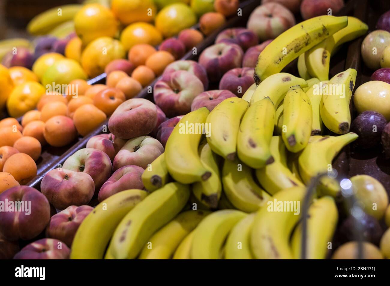 Mixed coloured fresh seasonal fruit at the market mall - consumerism ...