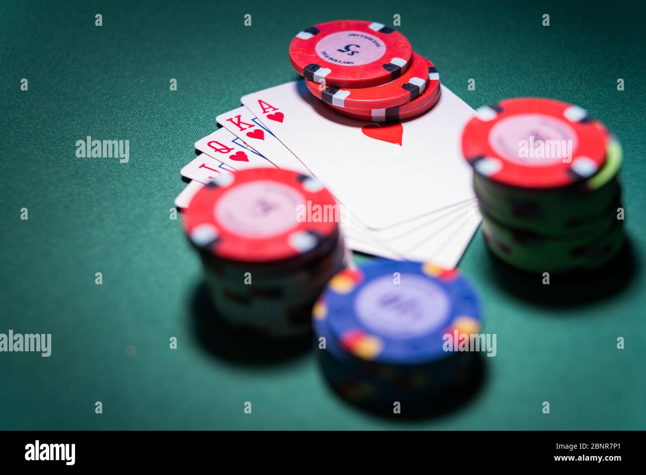 Poker game royal flush with chips Stock Photo - Alamy