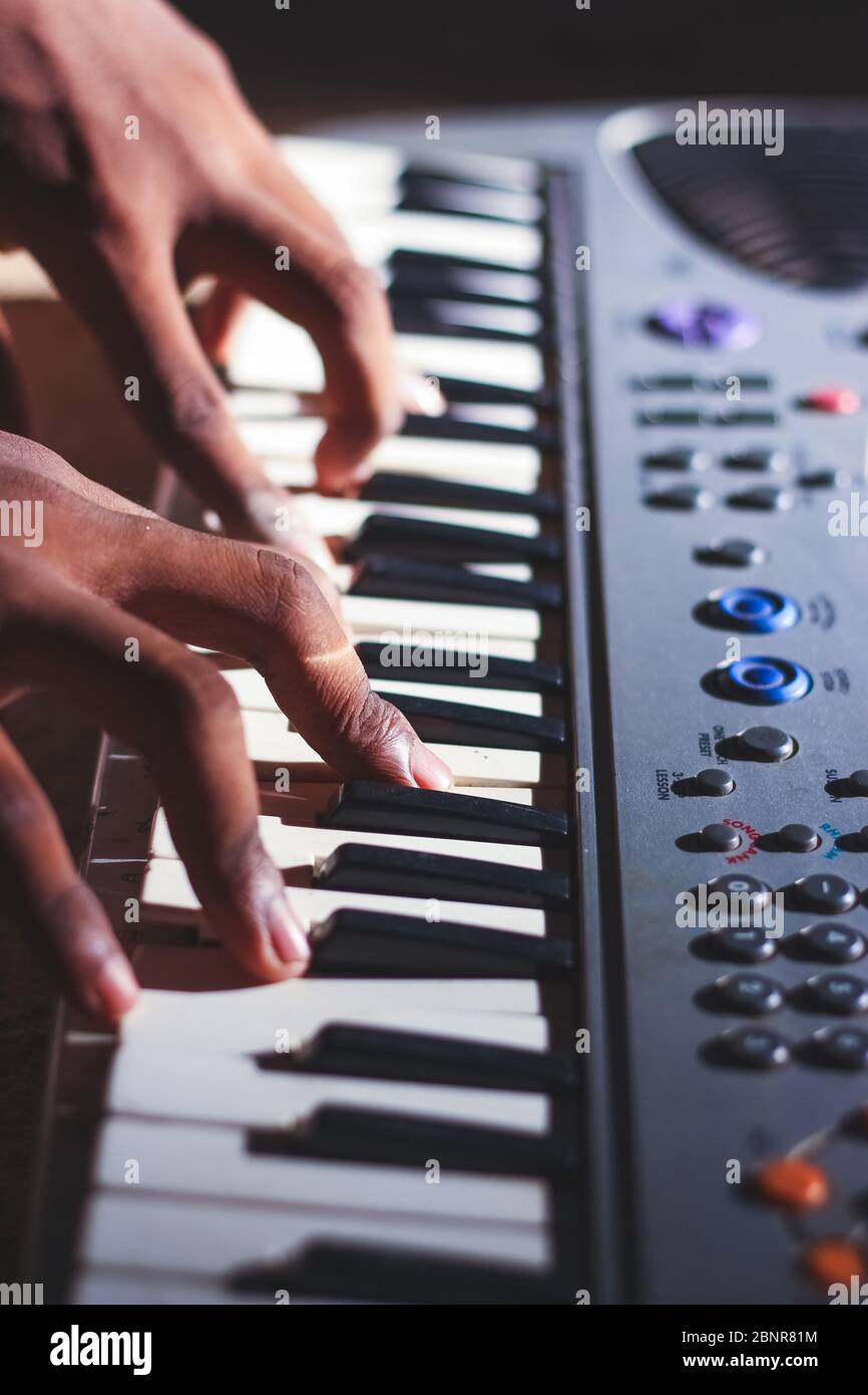 Music magician Playing the Electronic Keyboard in Music Recording ...