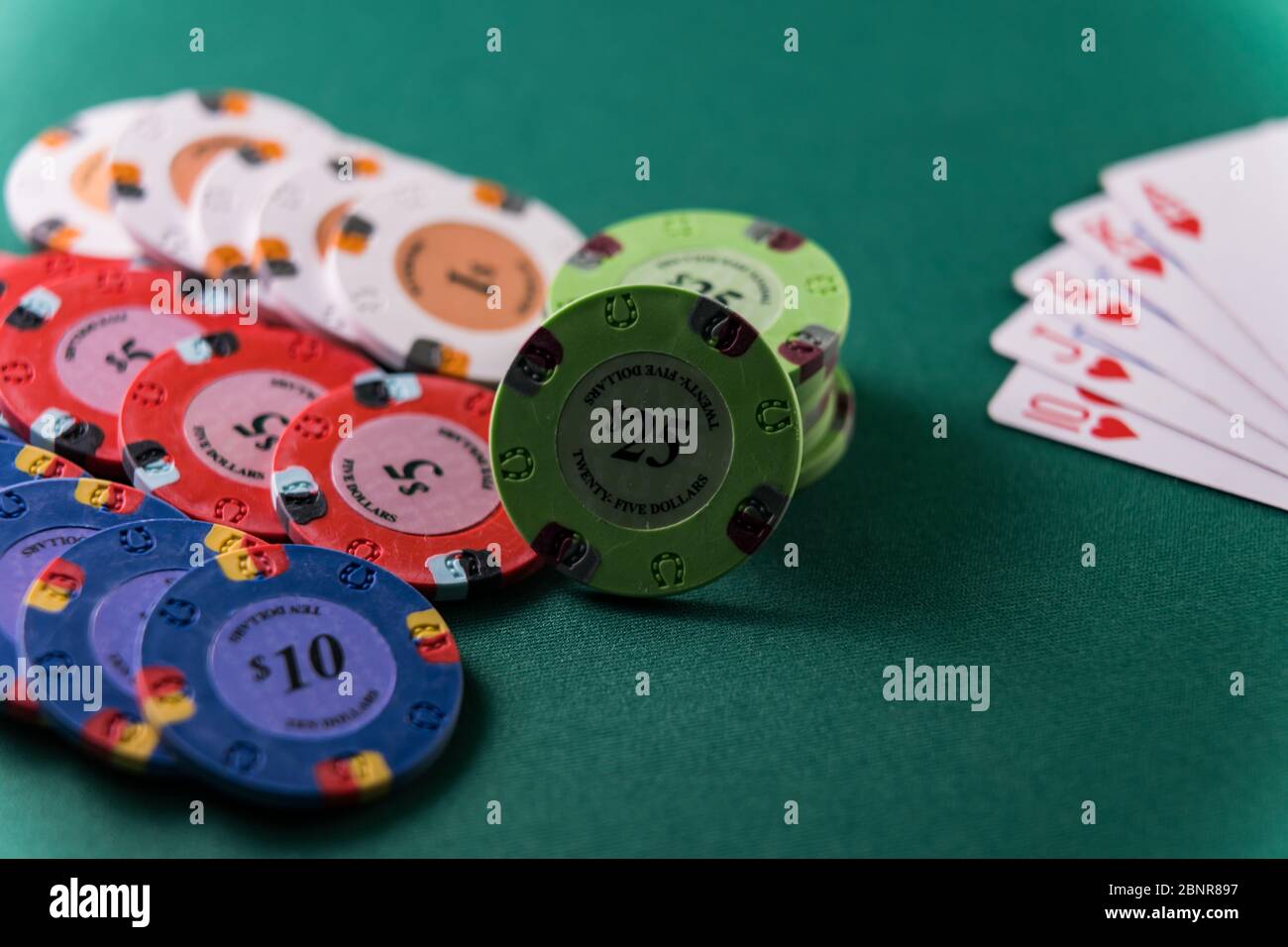 Poker game royal flush with chips Stock Photo - Alamy