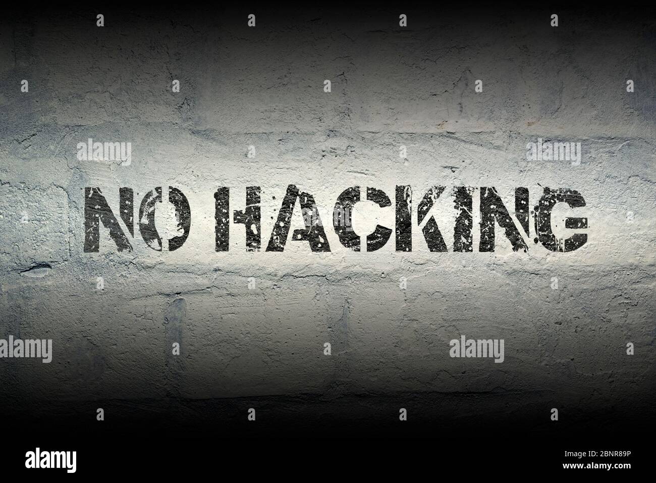 no hacking black stencil print on the grunge brick wall with gradient ...