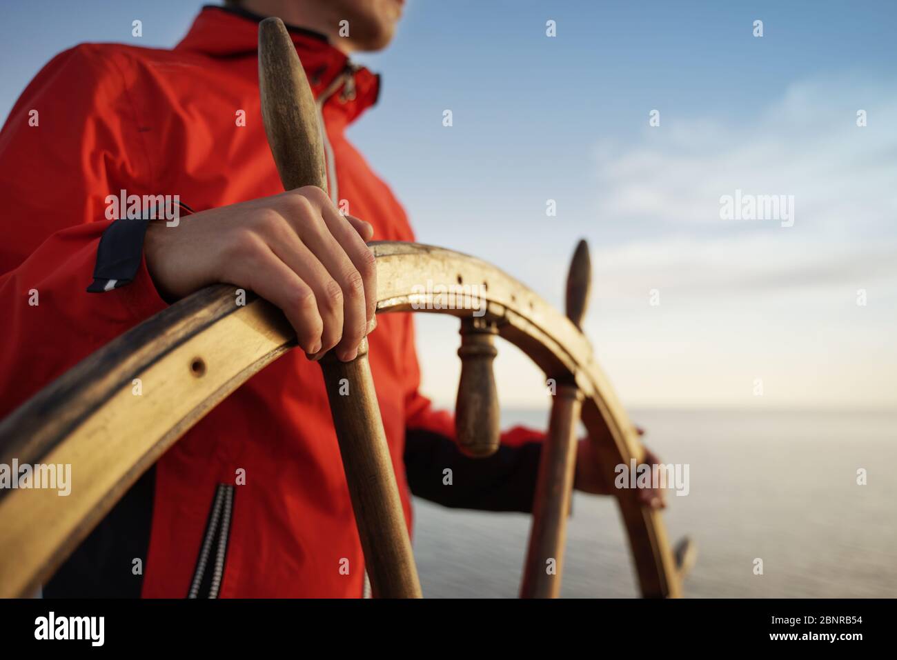 Man Holding Hands on ship rudder Stock Photo - Alamy