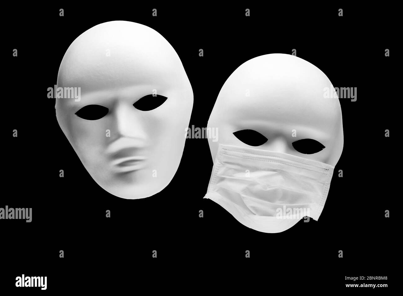 Human face masks with one wearing a medical mask isolated on black ...
