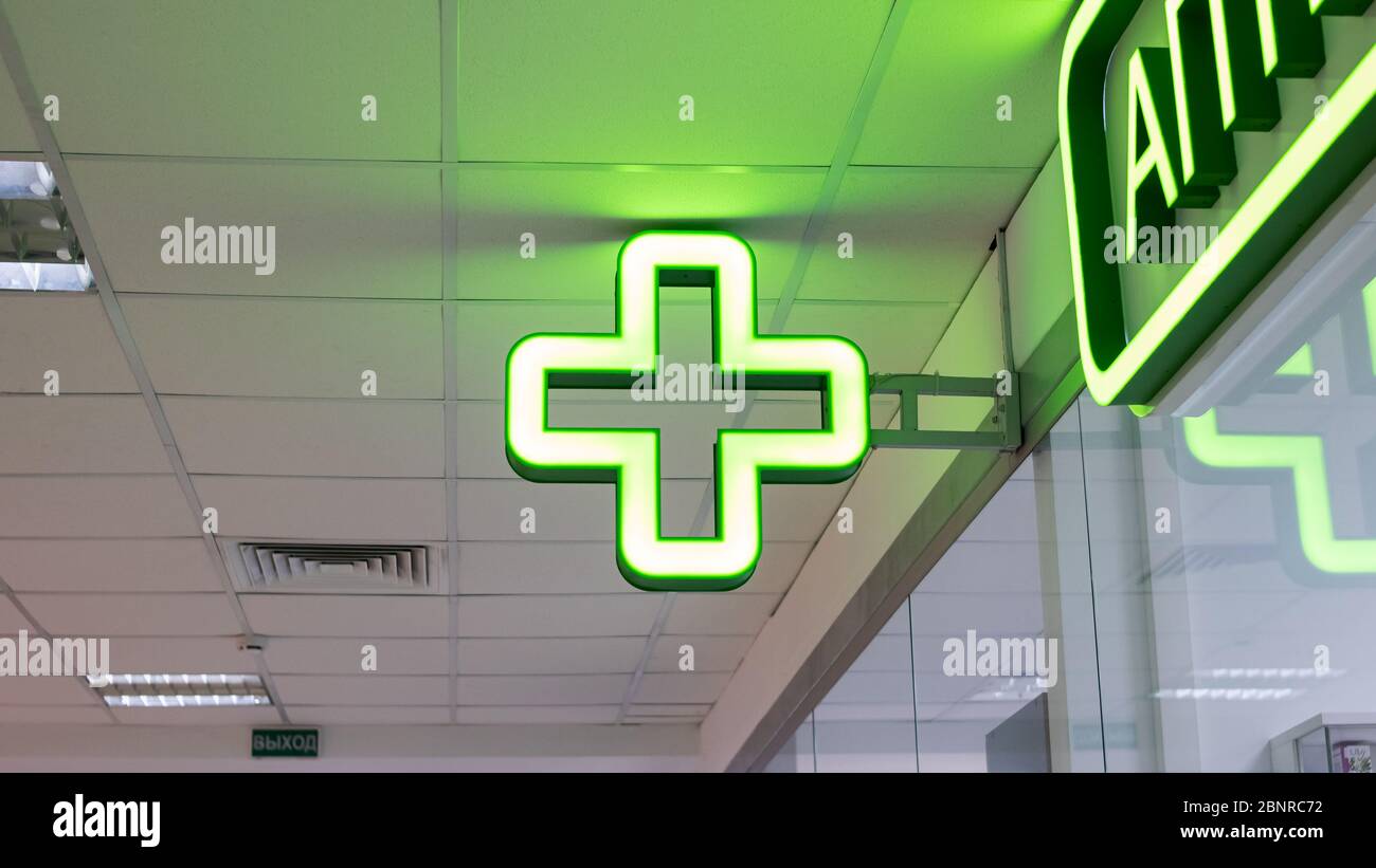 Pharmacy green light cross hi-res stock photography and images - Alamy