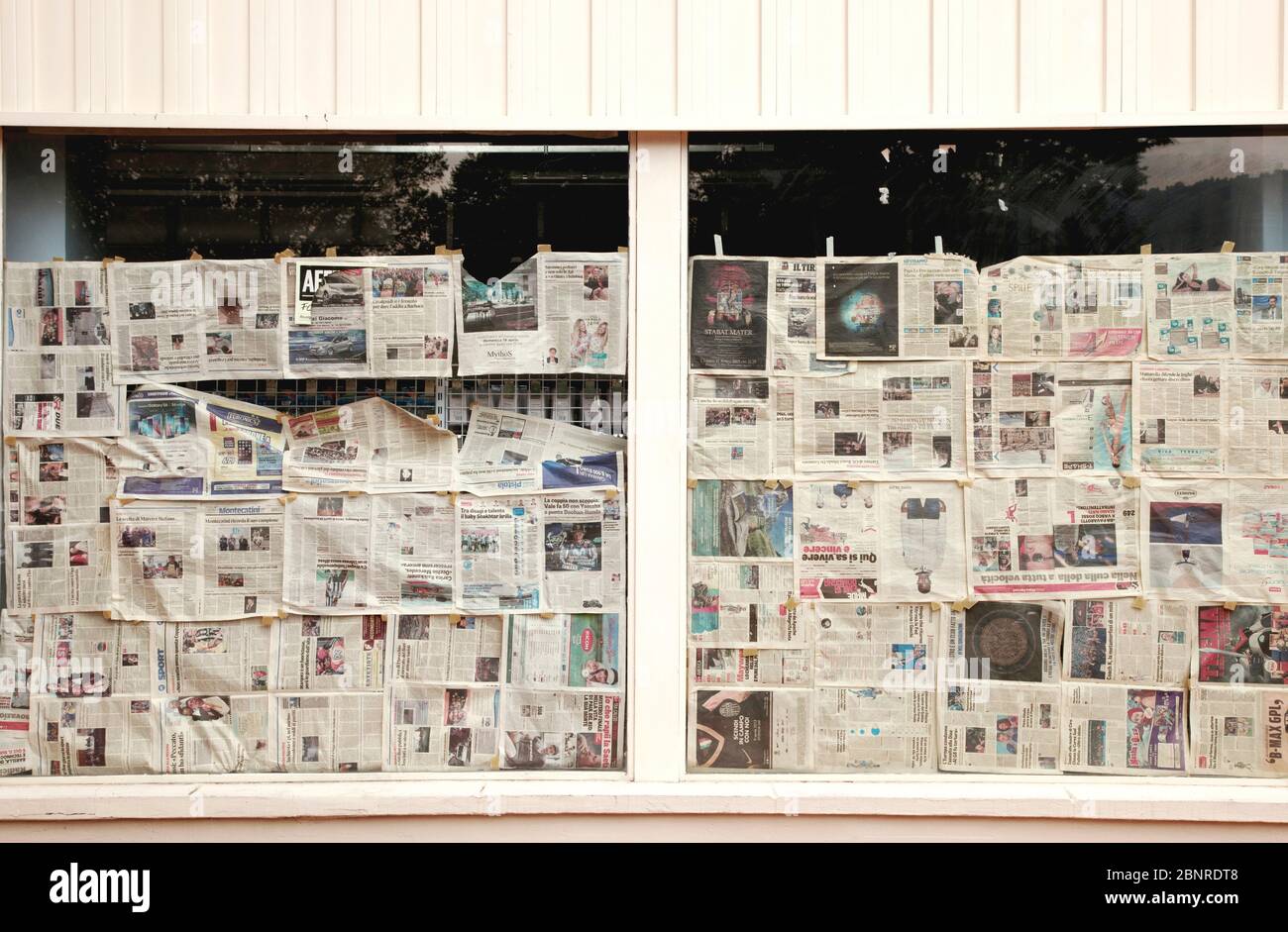 Window taped with newspaper in Prato, Tuscany, Italy Stock Photo - Alamy